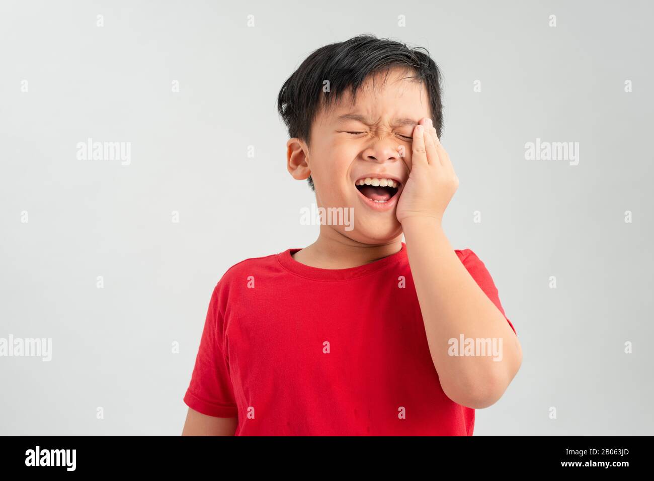 Little Asian boy suffering from toothache - Dental problem Stock Photo ...