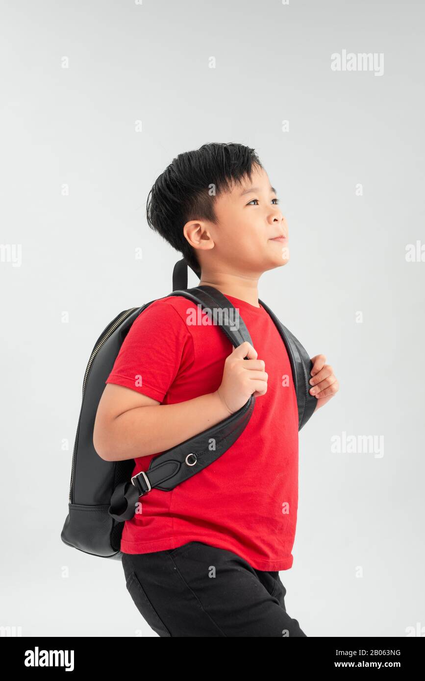 Confident little boy wearing backpack Stock Photo - Alamy