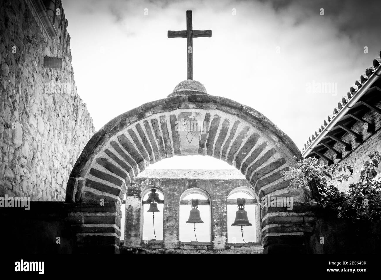Church cross and Mission Bells in California with White Sky at Mission ...