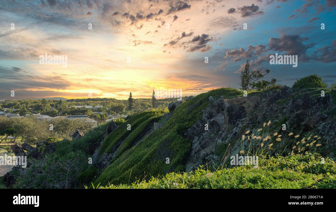 Coastal cliff face covered in vegetation against a stunningly dramatic ...