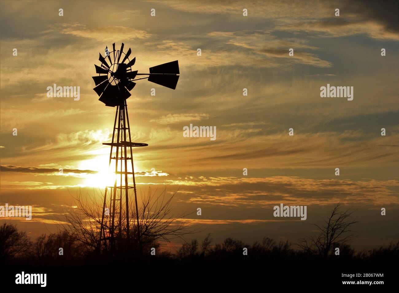 Kansas colorful Sunset with clouds,Sun,tree's, and a colorful sky with ...