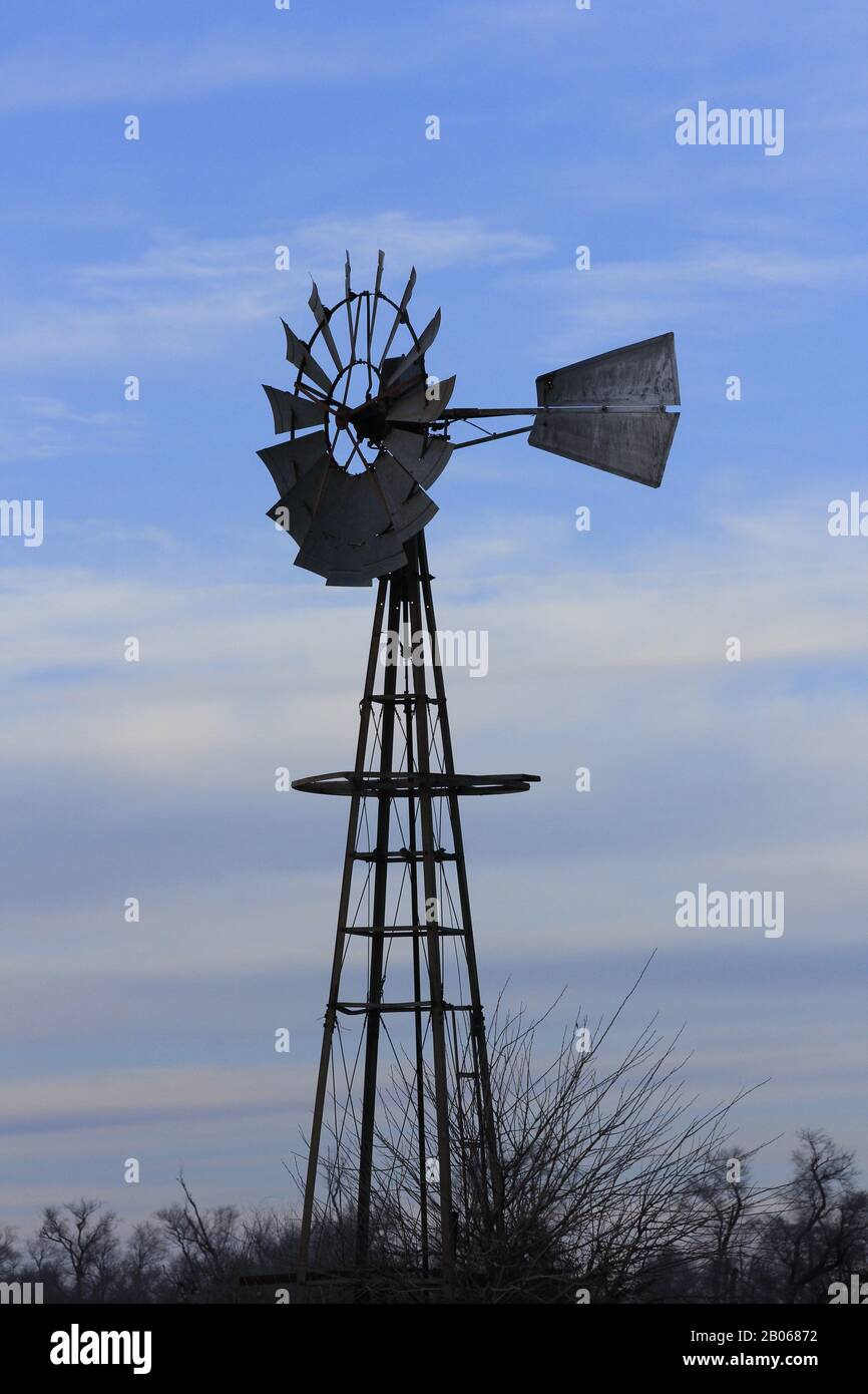 Kansas Country Windmill with blue sky and Tree's out in the country ...