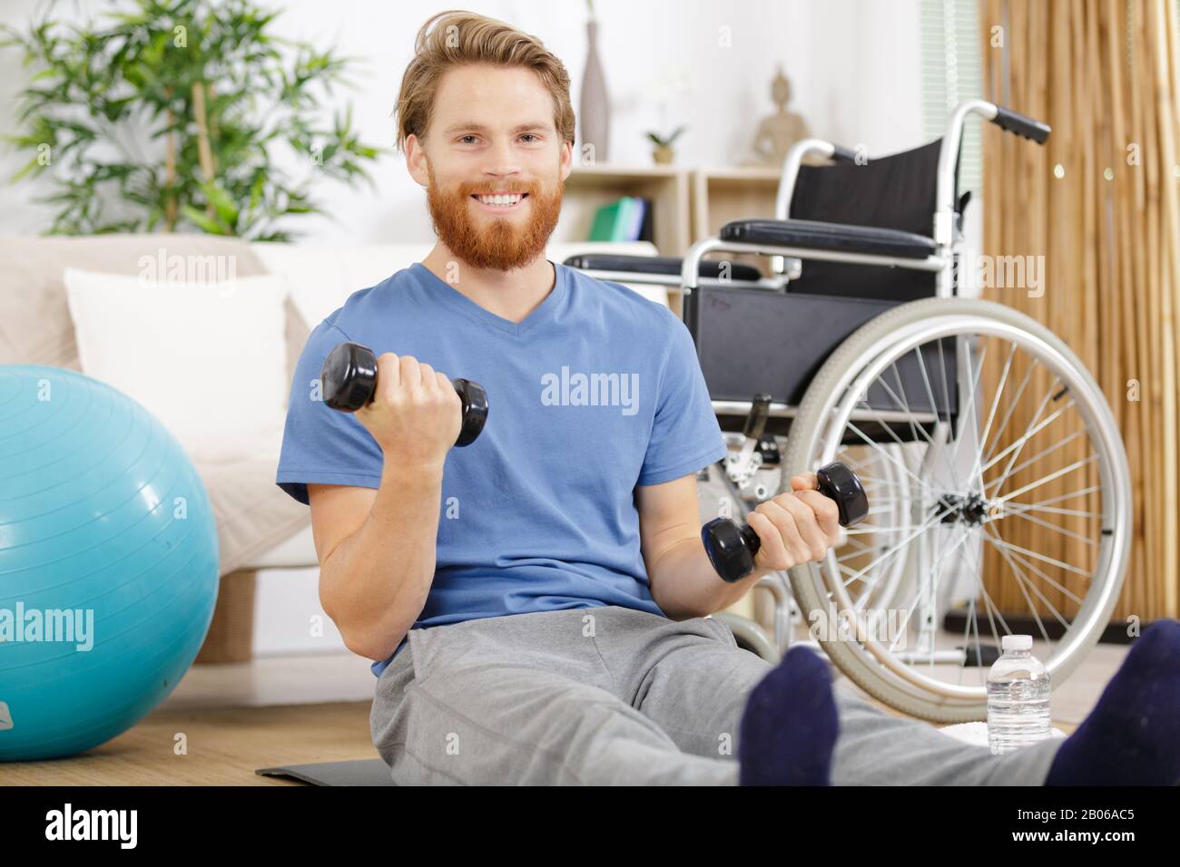 young handsome disabled paraplegic man in wheelchair Stock Photo - Alamy