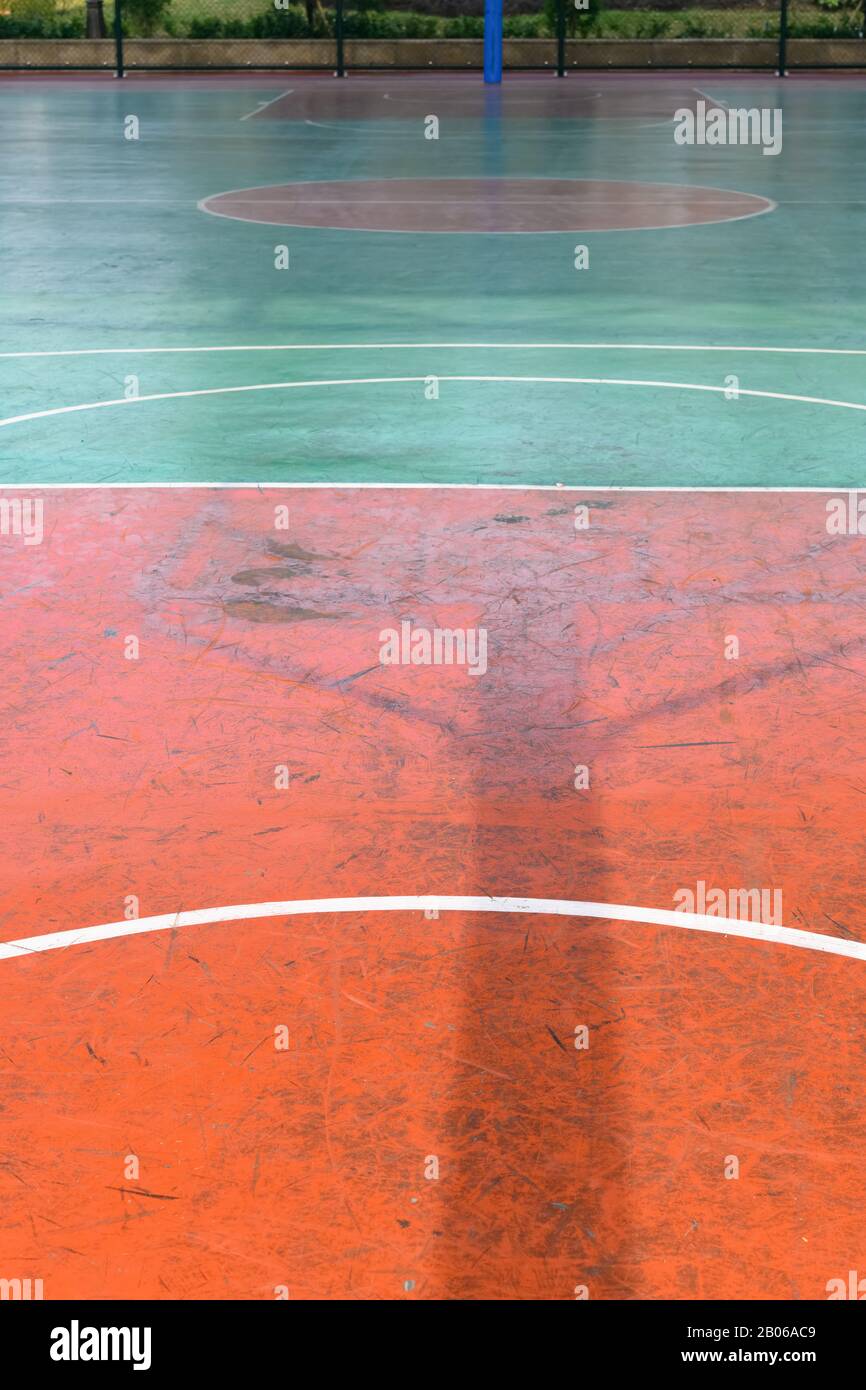 basketball frame shadow in an outdoor court vertical composition Stock ...