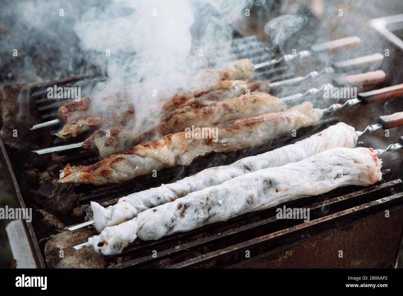The cook is cooking kebab. Cooking process Stock Photo - Alamy