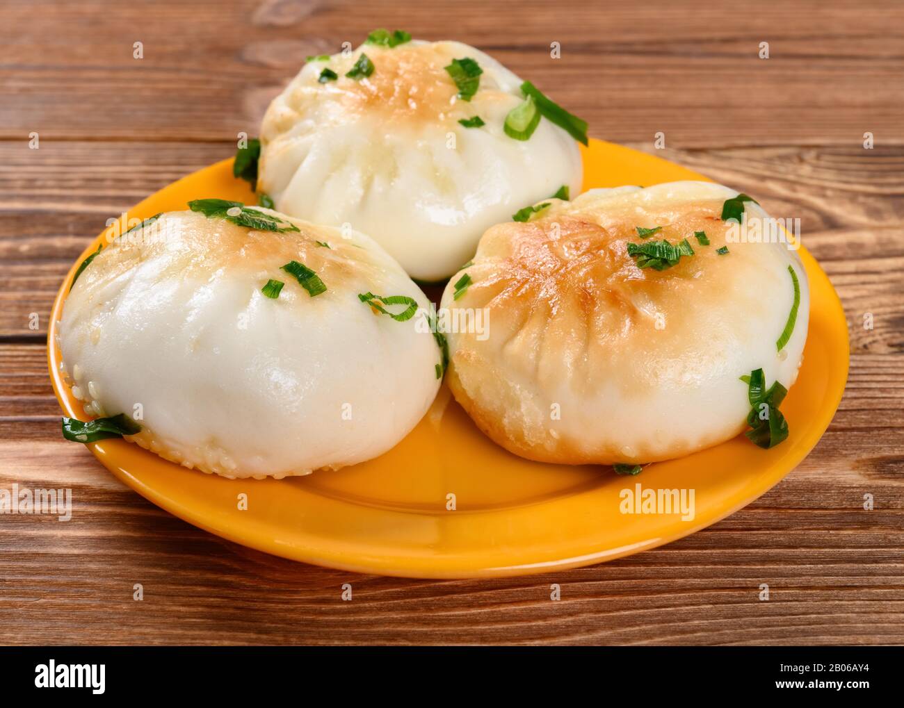 traditional Chinese fried bun on a wood table Stock Photo - Alamy