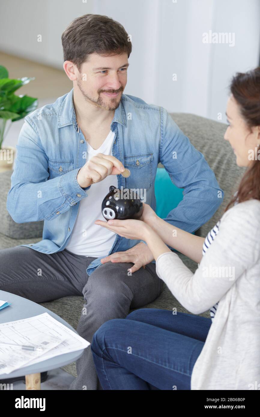 a young couple making economy Stock Photo - Alamy