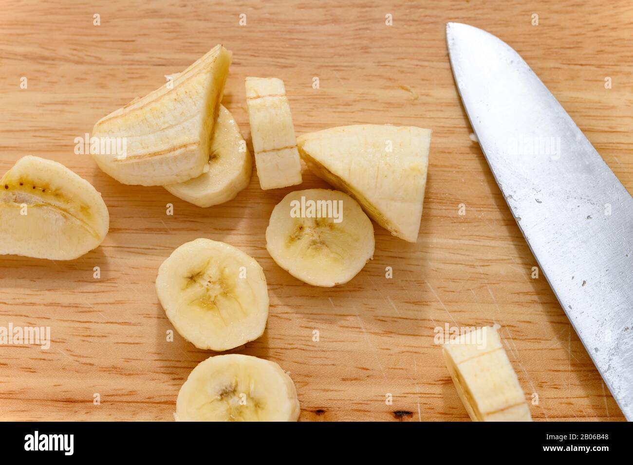 fresh banana slices with a knife Stock Photo - Alamy