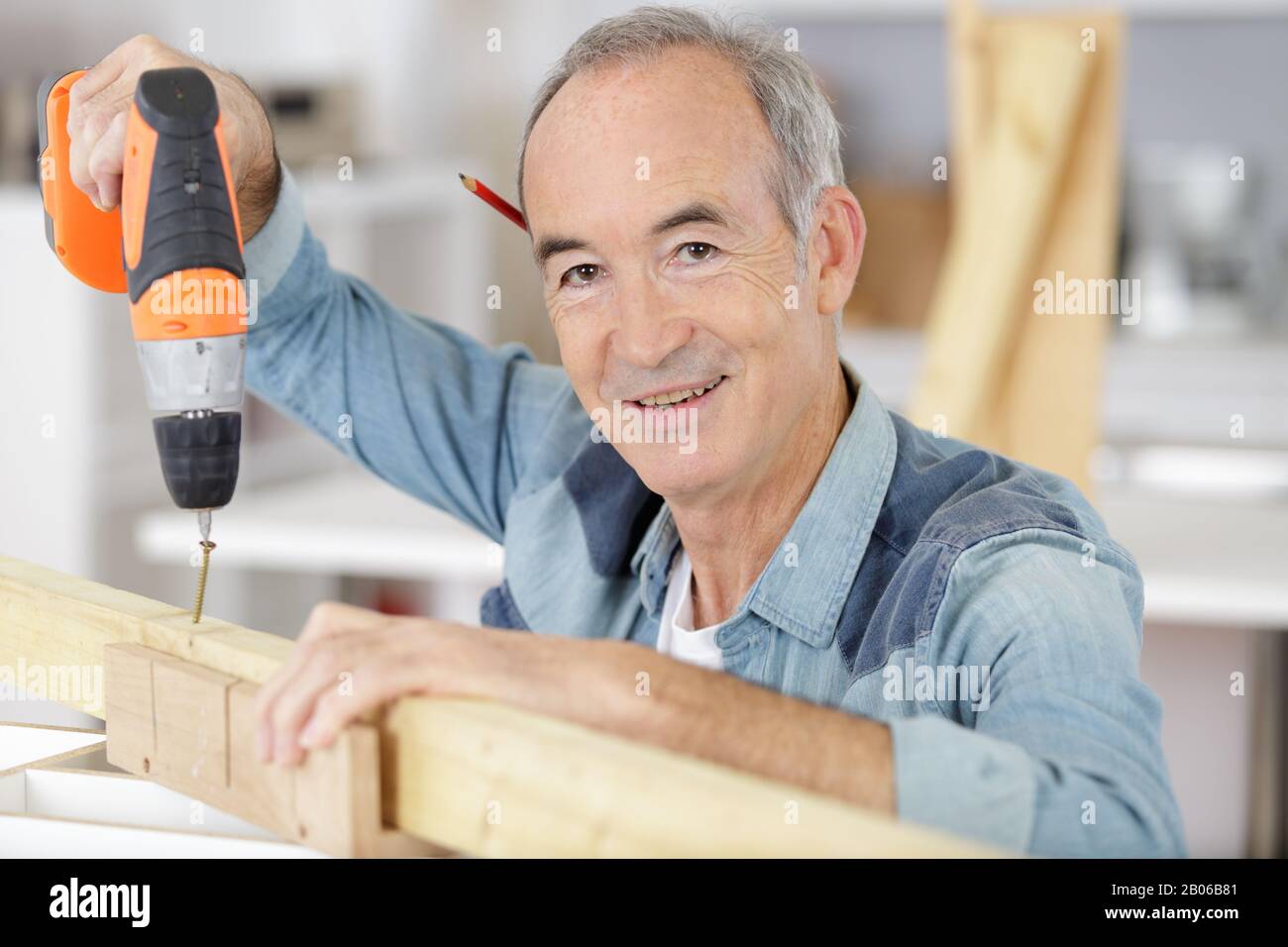 Senior handyman working on hi-res stock photography and images - Alamy