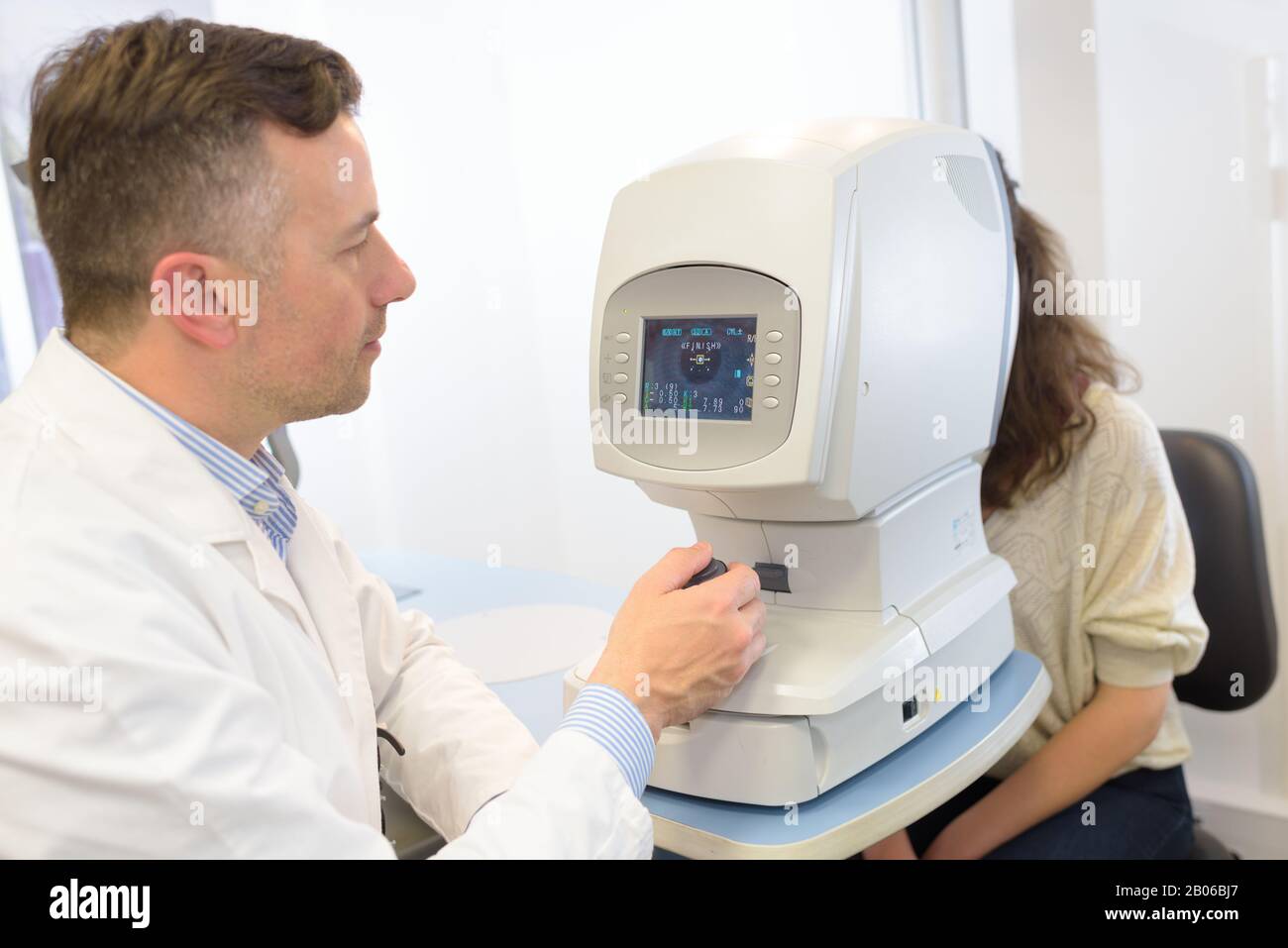 a doctor and retinal exam Stock Photo - Alamy