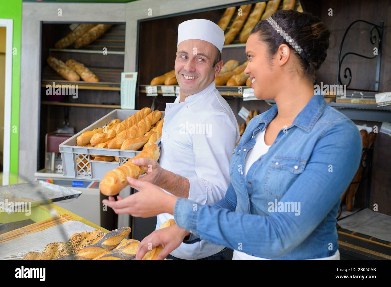 view of a team of bakers working at the bakery Stock Photo - Alamy