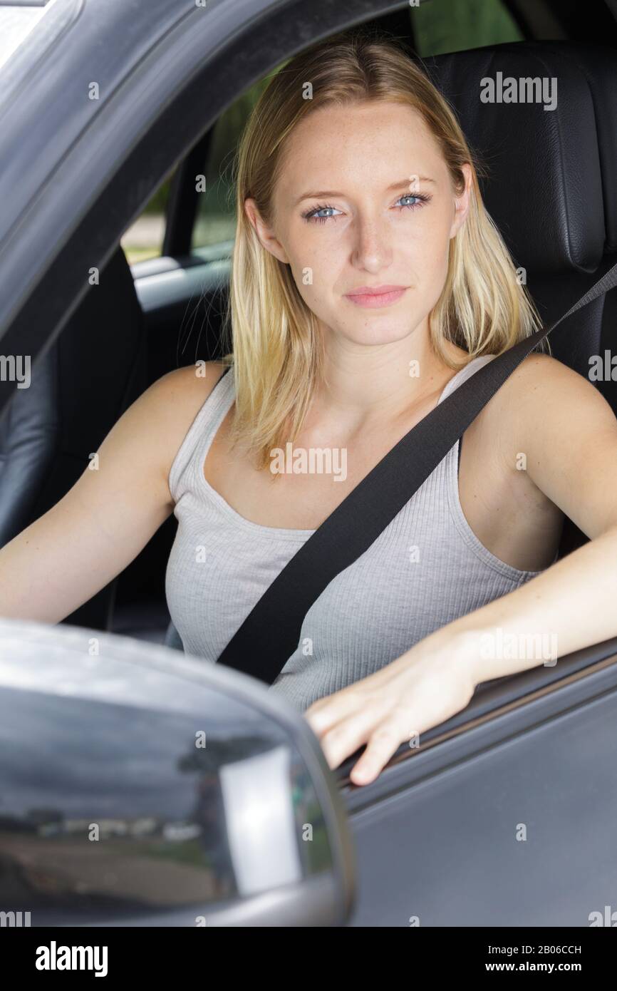 beautiful young happy woman in car Stock Photo - Alamy