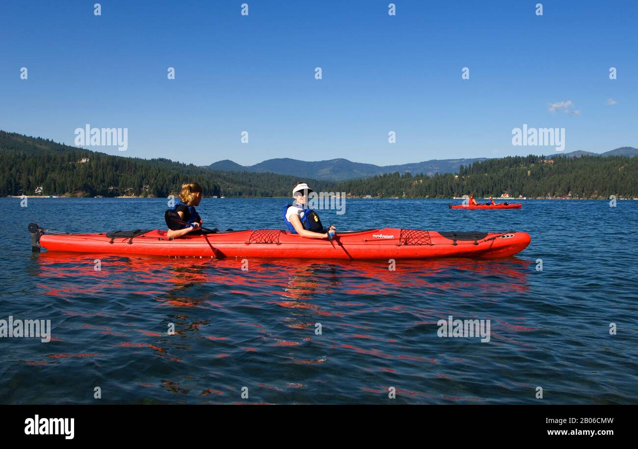 USA, IDAHO, COEUR D'ALENE, COEUR D'ALENE LAKE, PEOPLE SEA KAYAKING ...