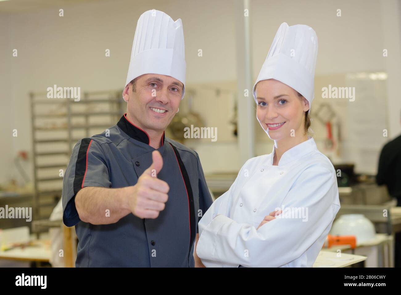 two smiling chocolate chefs smiling at the camera Stock Photo - Alamy