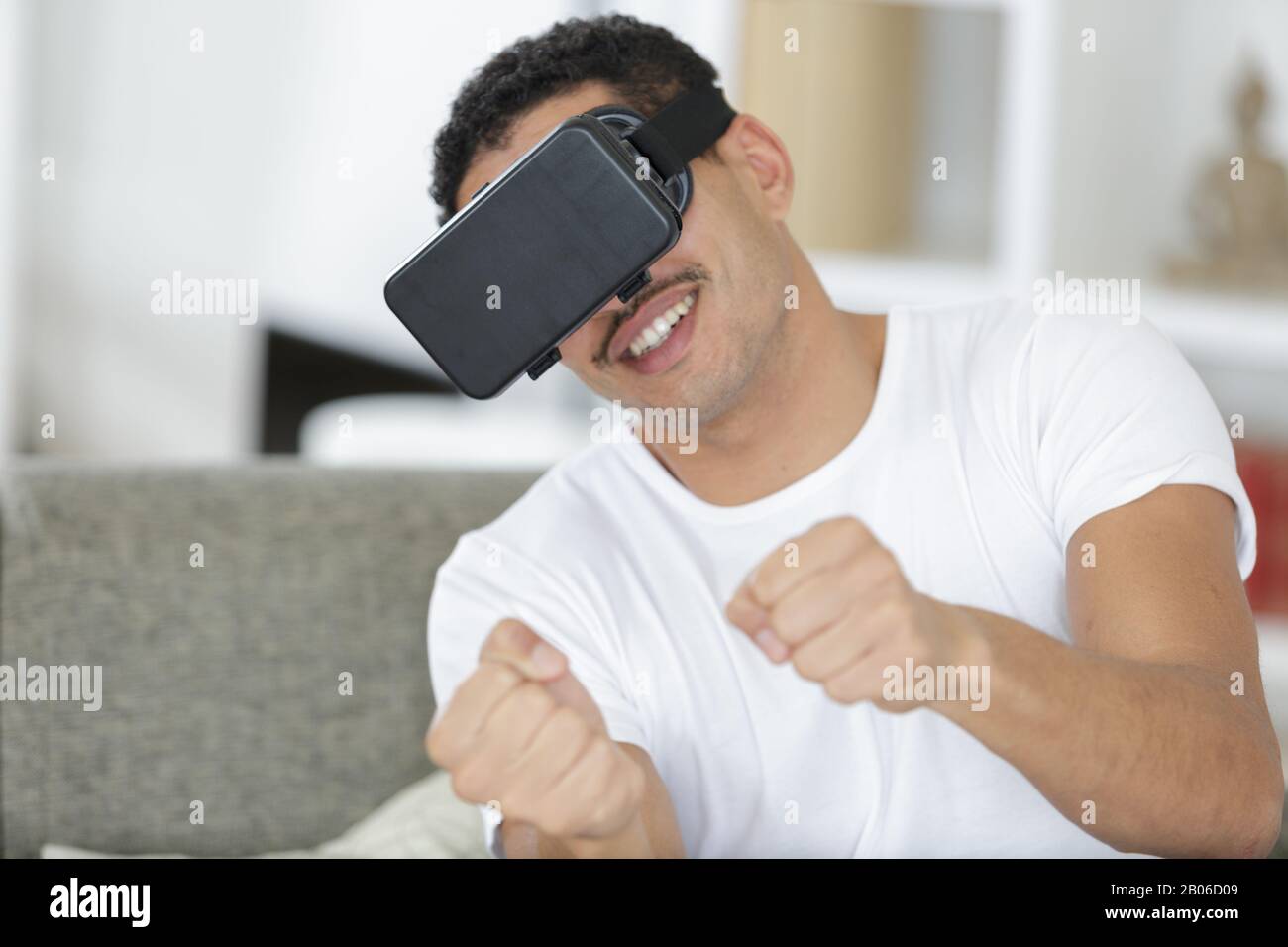 young man driving in virtual reality wearing futuristic vr headset ...