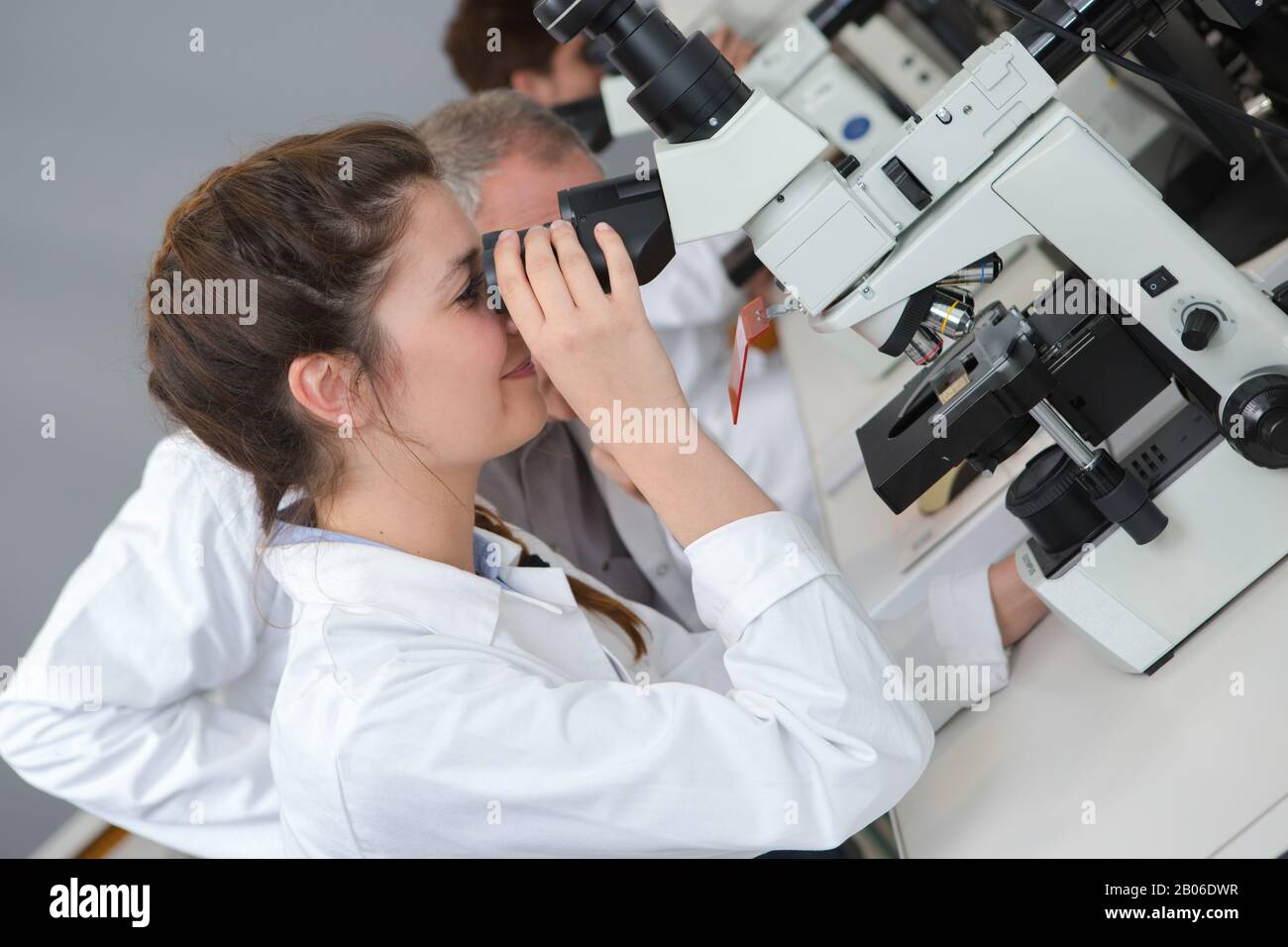 Lady in lab coat microscope hi-res stock photography and images - Alamy
