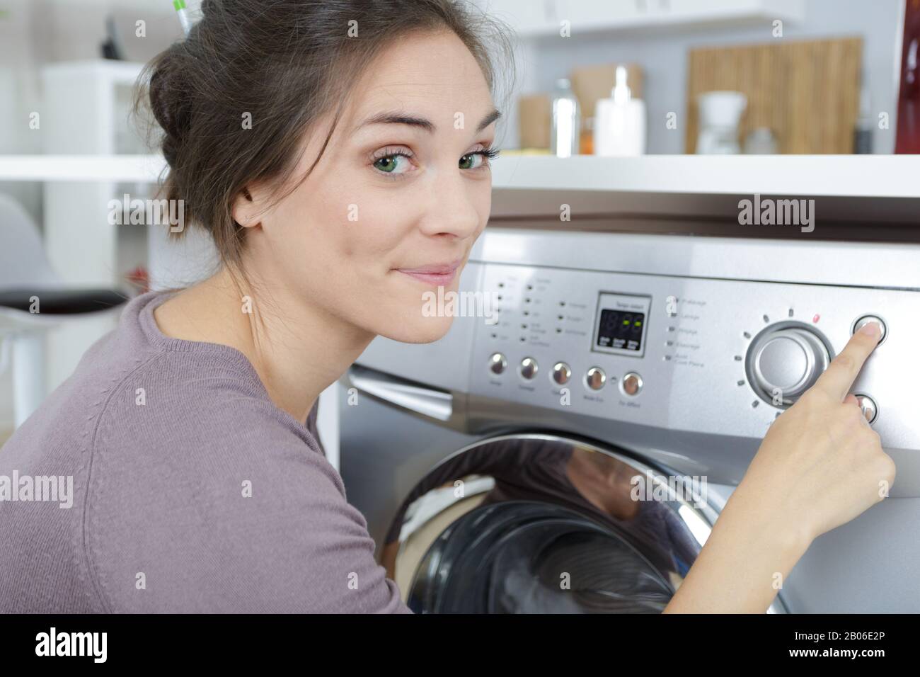 Lady doing laundry hi-res stock photography and images - Alamy