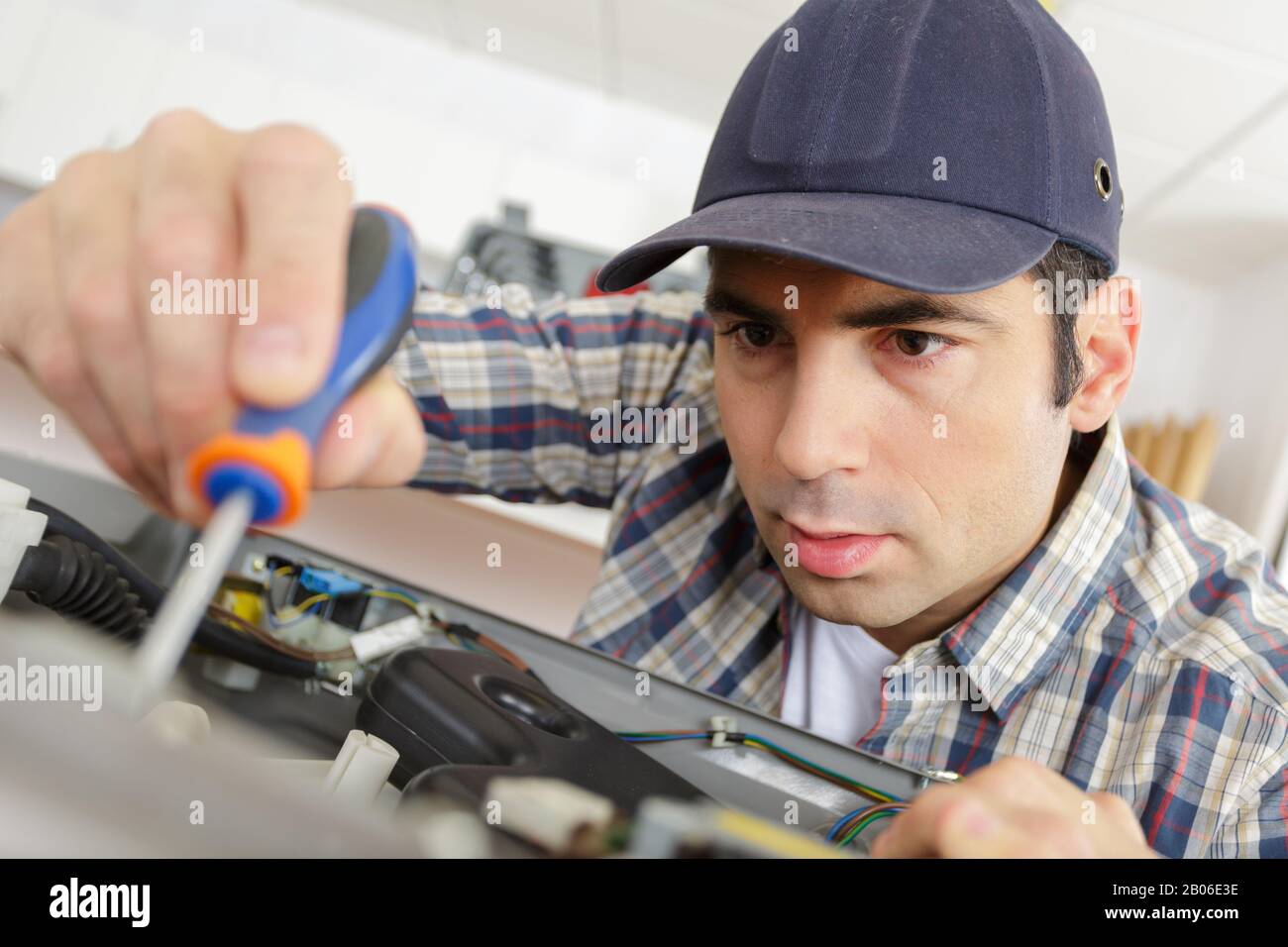 a man fixing a machine working hands Stock Photo - Alamy