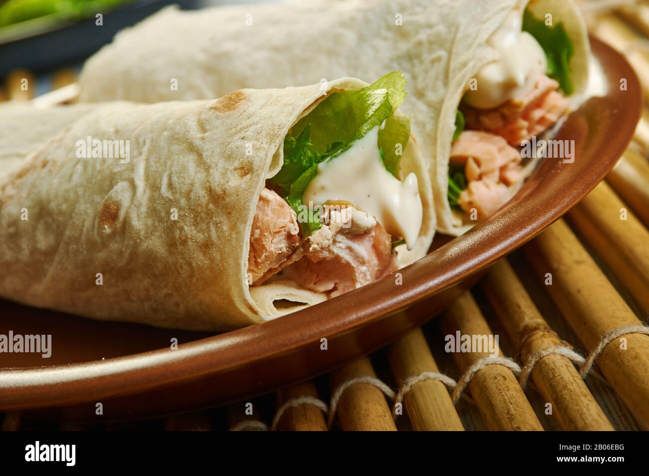 Salmon and Kale Caesar Wraps shredded Parmesan cheese Stock Photo - Alamy