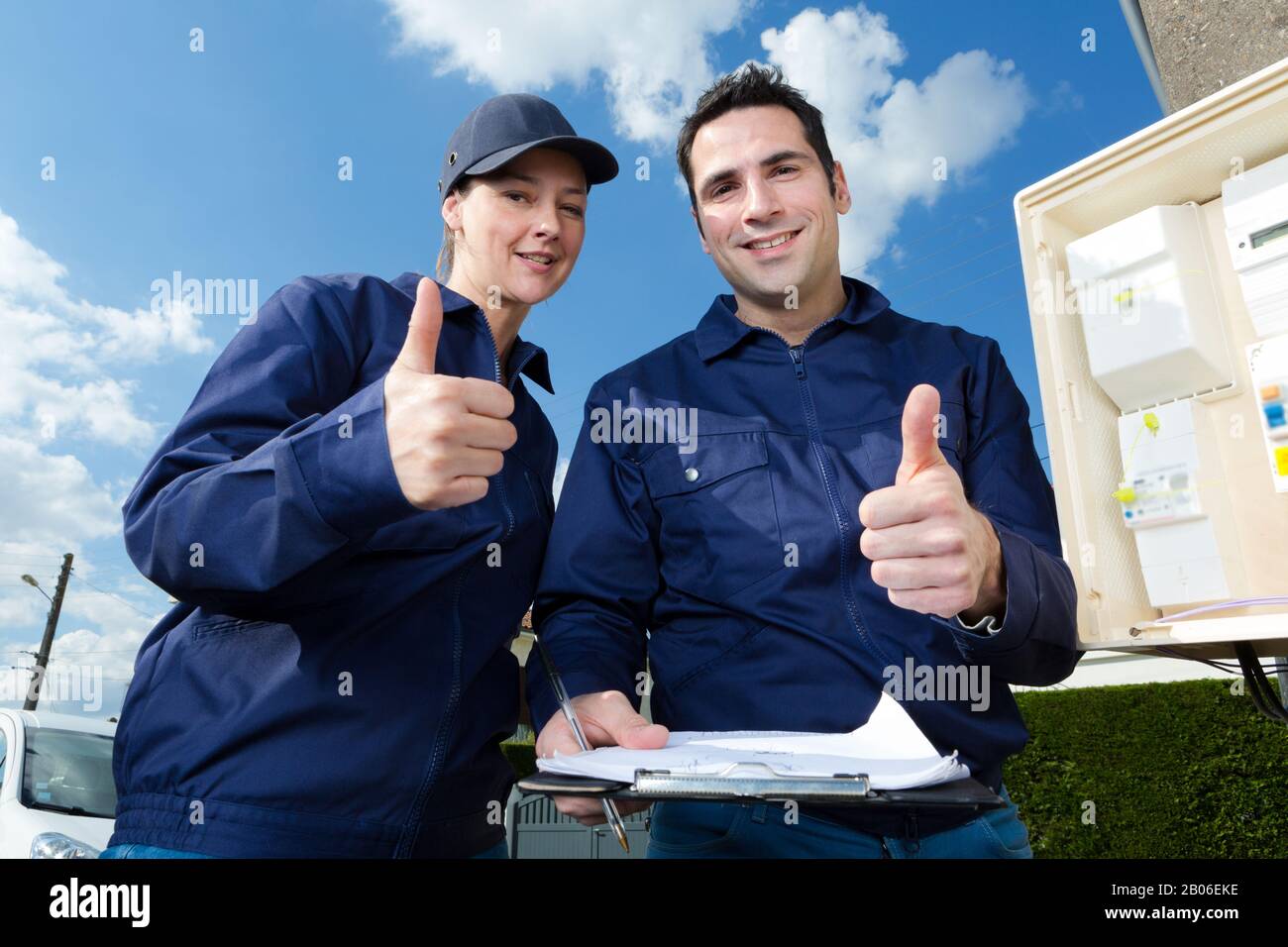two engineers giving thumbs up Stock Photo - Alamy