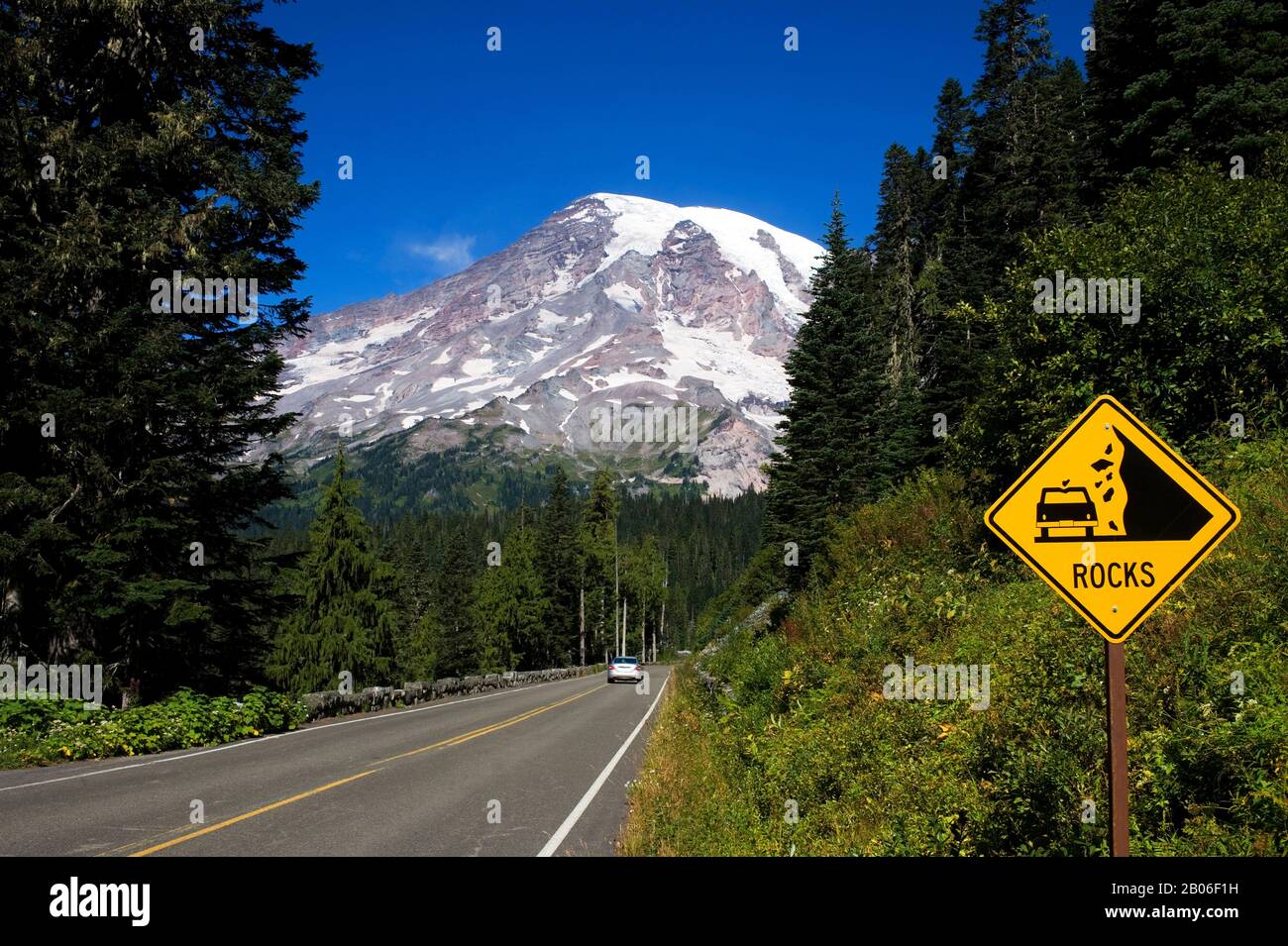 USA, WASHINGTON STATE, MT. RAINIER NATIONAL PARK, HIGHWAY WITH CAR, MT ...