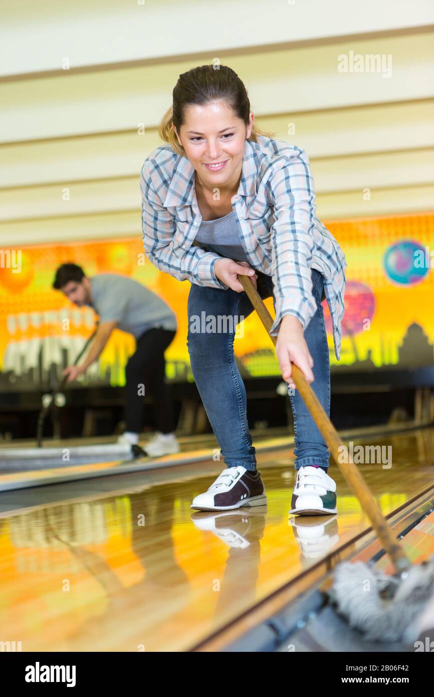 woman cleaning bowling alley lane Stock Photo - Alamy