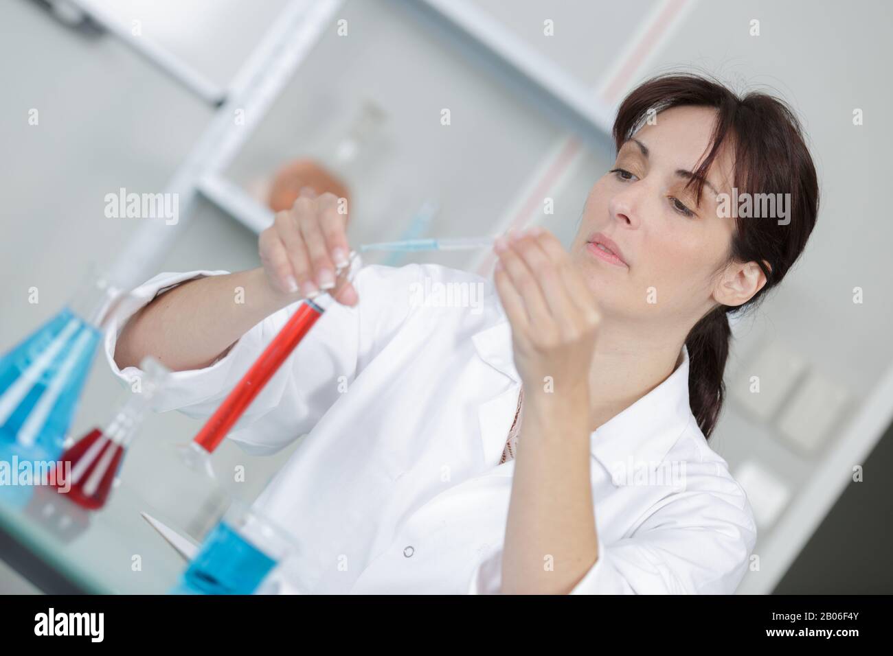 Female scientist using pipette liquid hi-res stock photography and ...