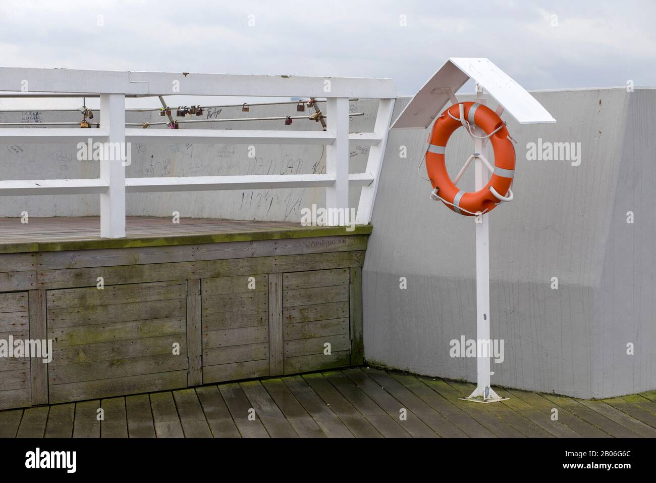 Single orange lifebuoy Stock Photo - Alamy
