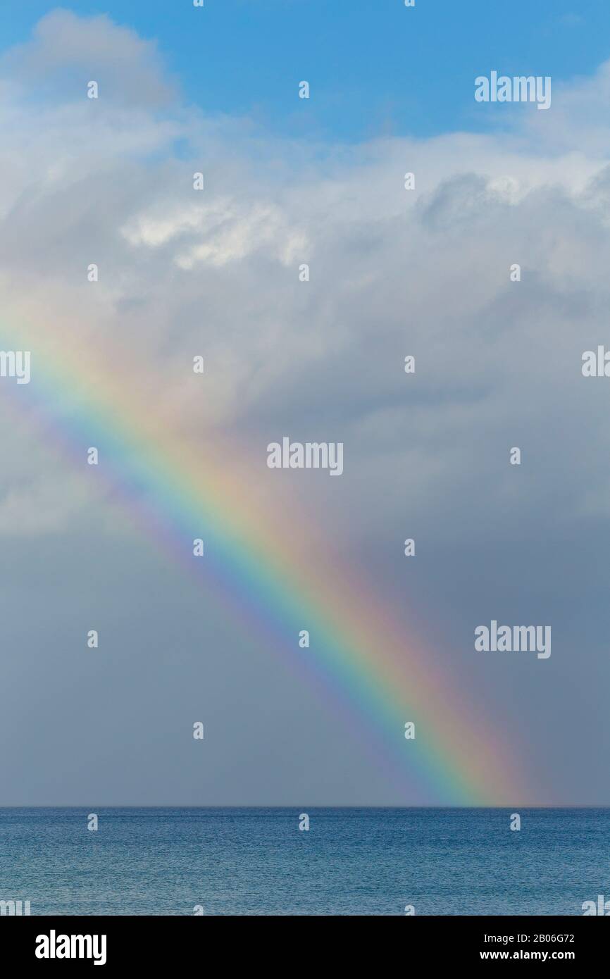Rainbow and the sea line Stock Photo - Alamy