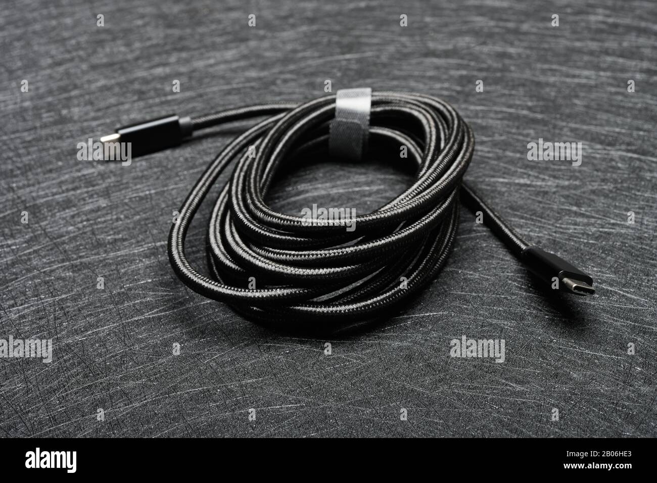 side view black type C cable on a dark background Stock Photo - Alamy