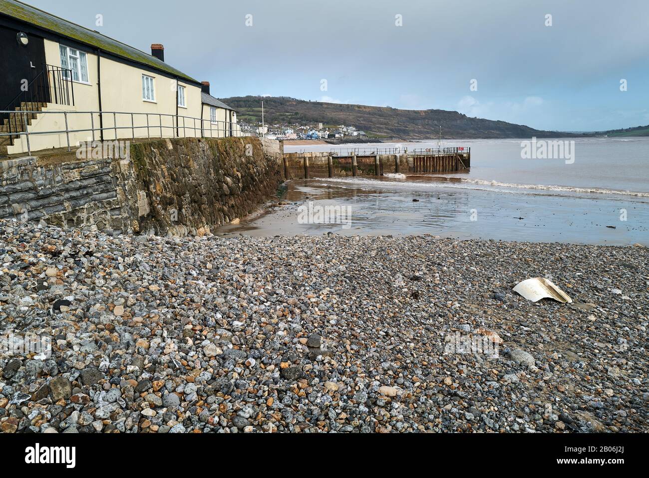 Shingle beach in the harbour of Lyme Bay at Lyme Regis on the English ...