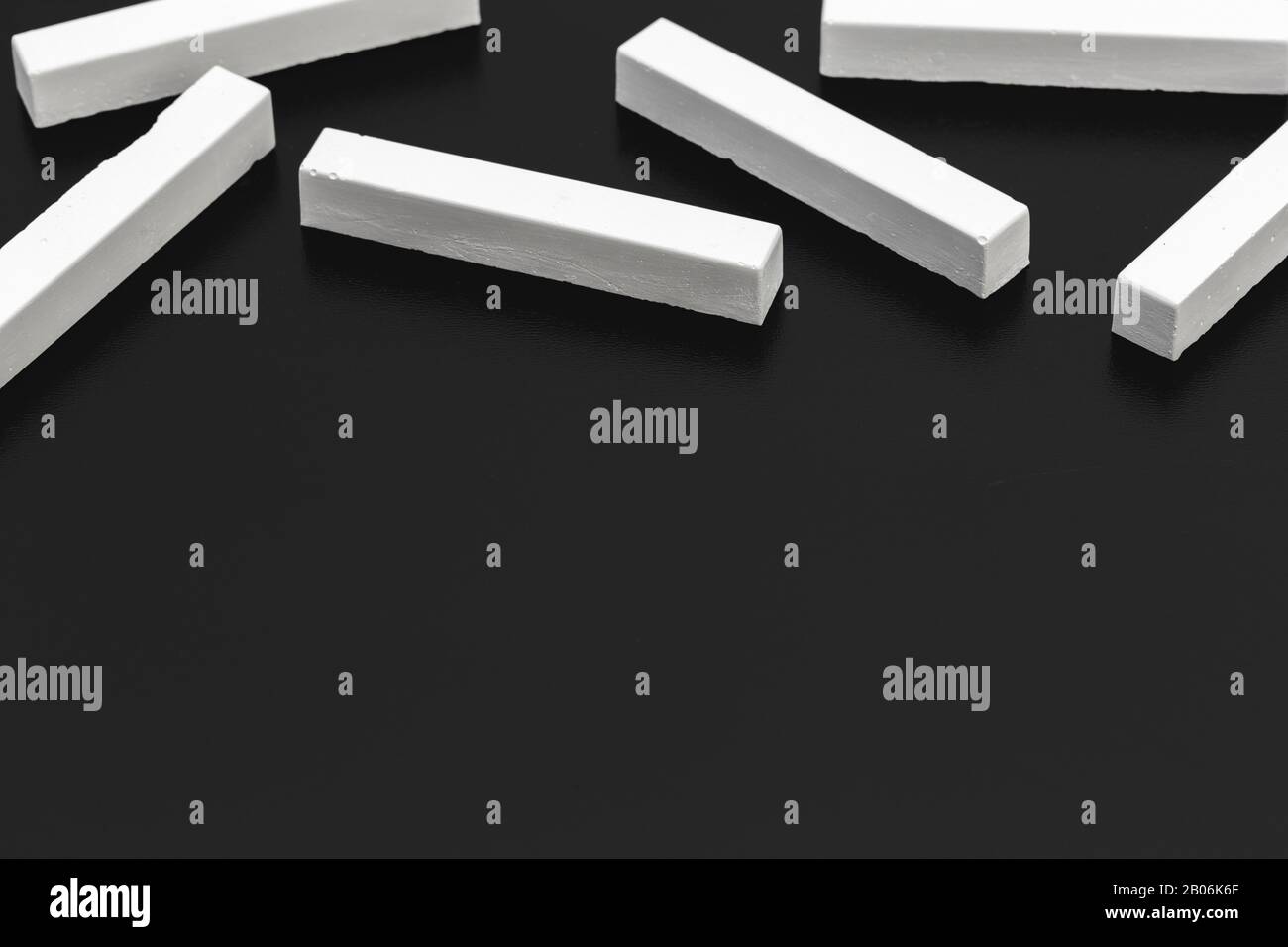 pieces of white chalk photographed over a blackboard. Creative Photo ...