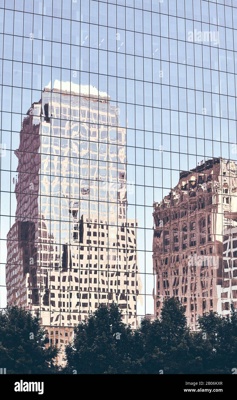 New York old buildings reflected in windows of a modern skyscraper ...