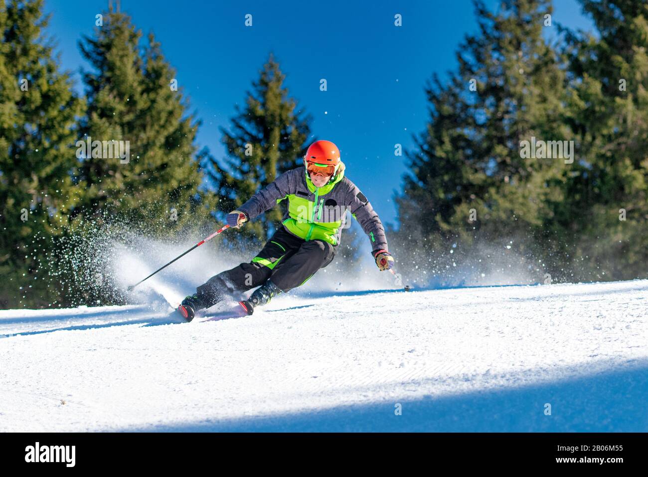 Very good skier during a carving curve Stock Photo - Alamy