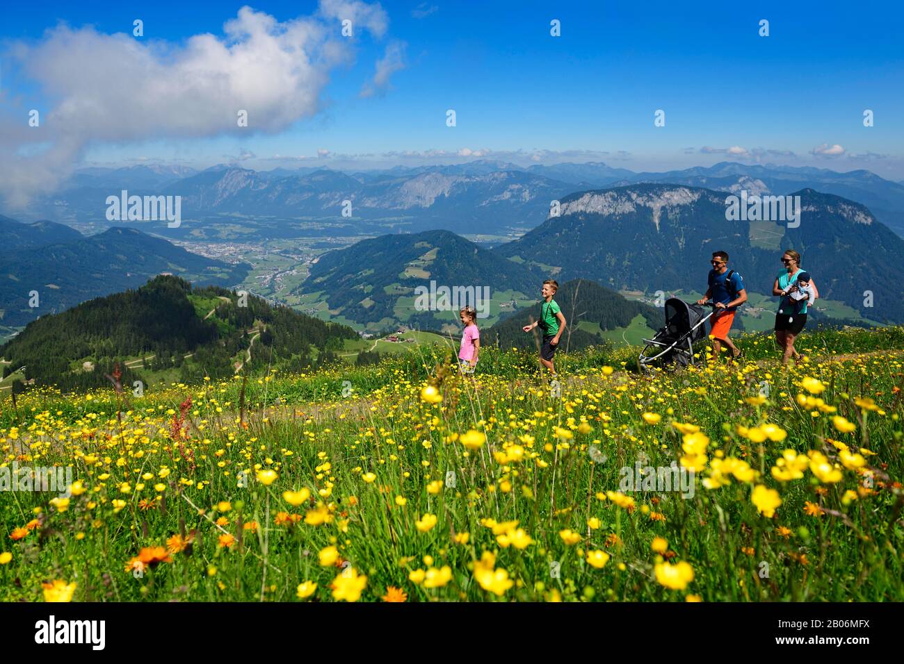 Family hiking on the summit panorama trail of the Hohe Salve ...