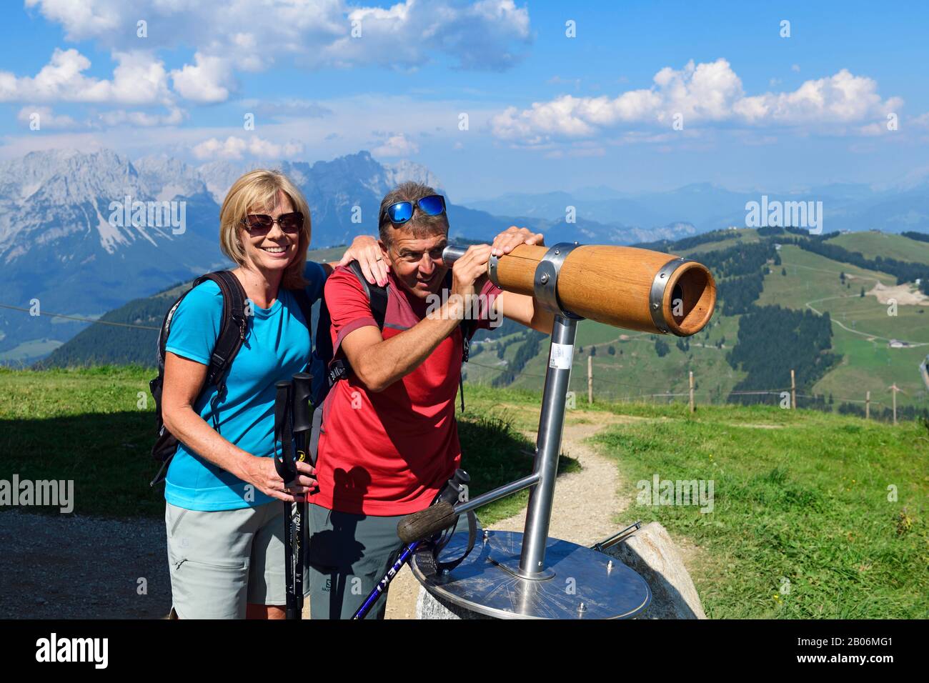 Hikers on the summit panorama trail of the Hohe Salve looking through a ...