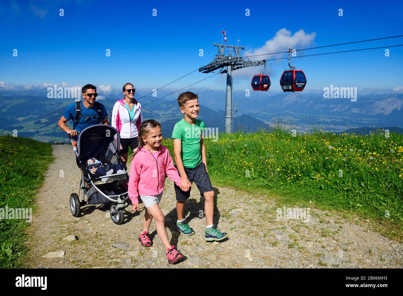 Family hiking on the summit panorama trail of the Hohe Salve ...