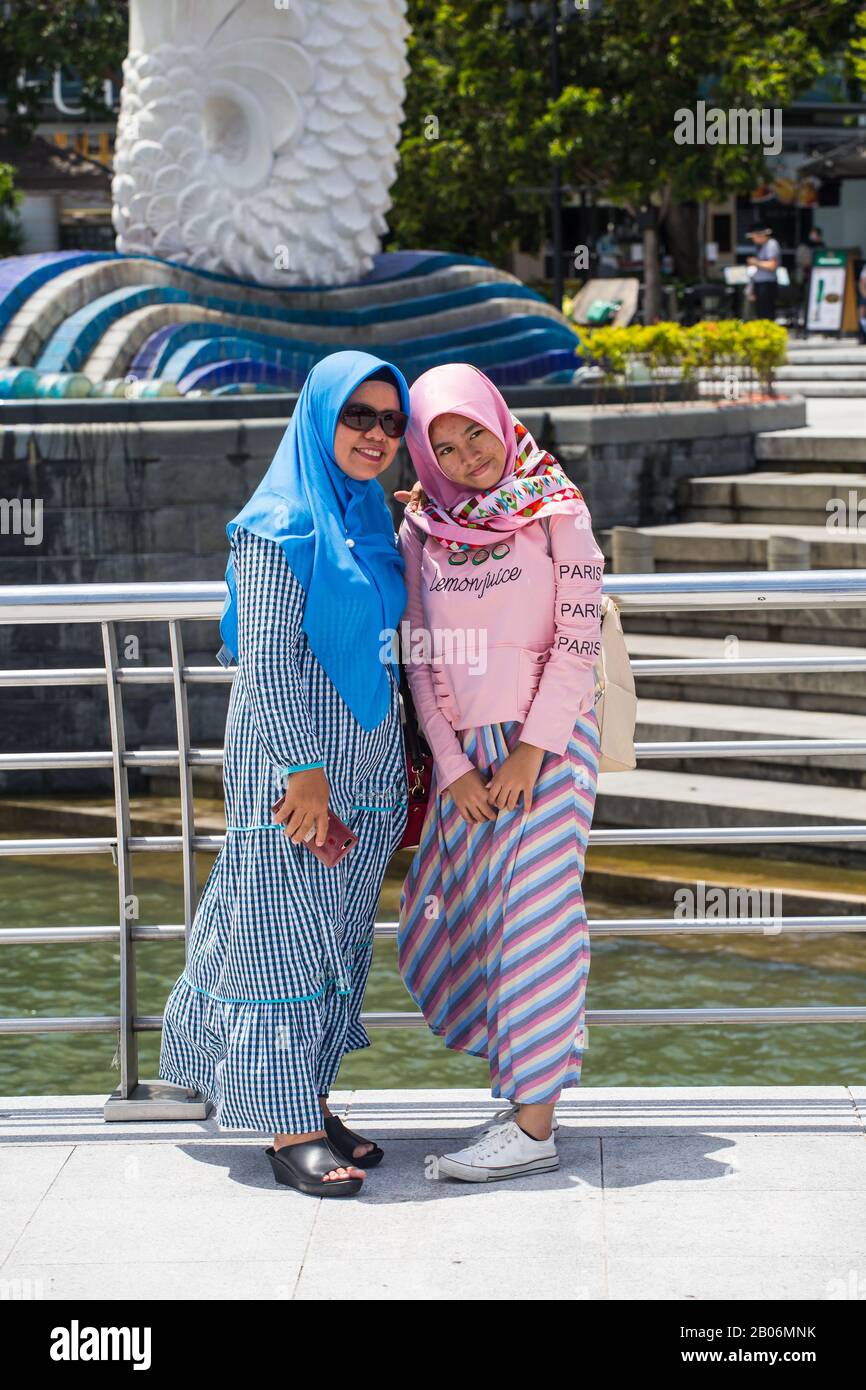 Two Indonesia muslim women of multiple generations, wearing beautiful ...