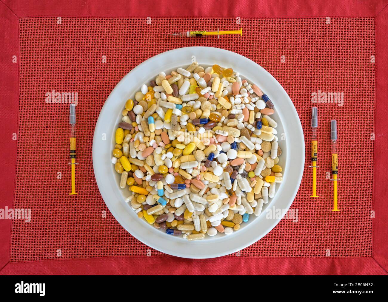 Symbol picture drug abuse, plate with tablets and syringes, Germany ...