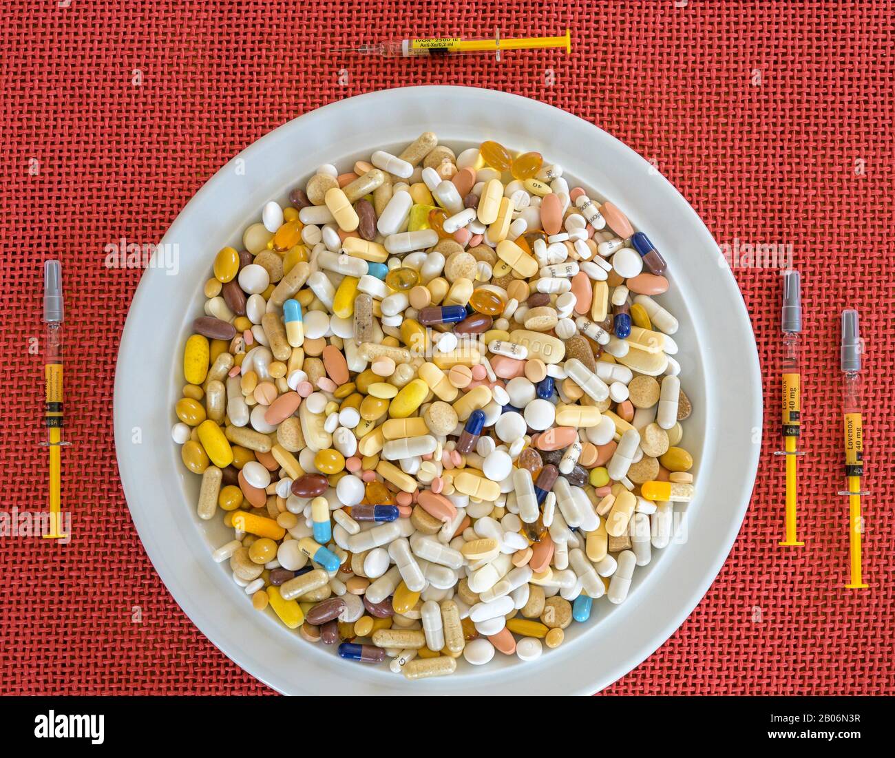 Symbol picture drug abuse, plate with tablets and syringes, Germany ...