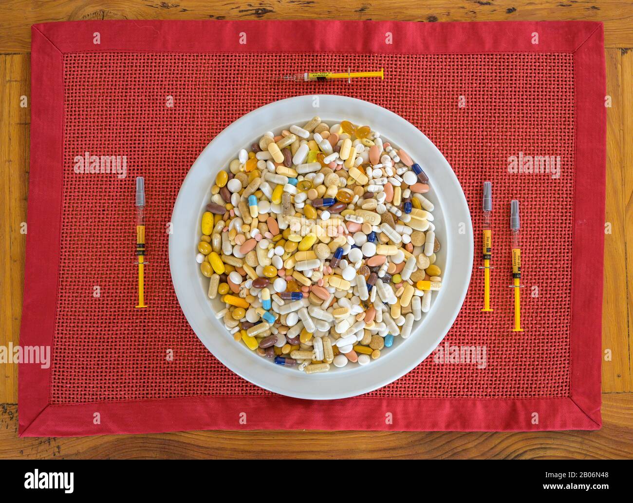 Symbol picture drug abuse, plate with tablets and syringes, Germany ...