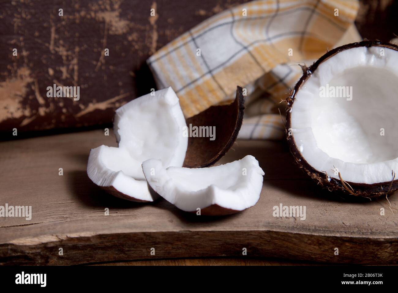 Coconut. Coconut shell, coconut flakes and small pieces of crashed nut ...