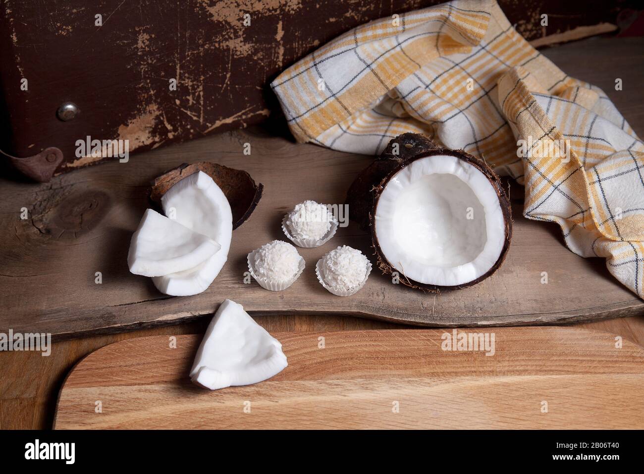 Coconut and sweet chocolate coconut truffles. Coconut shell, coconut ...