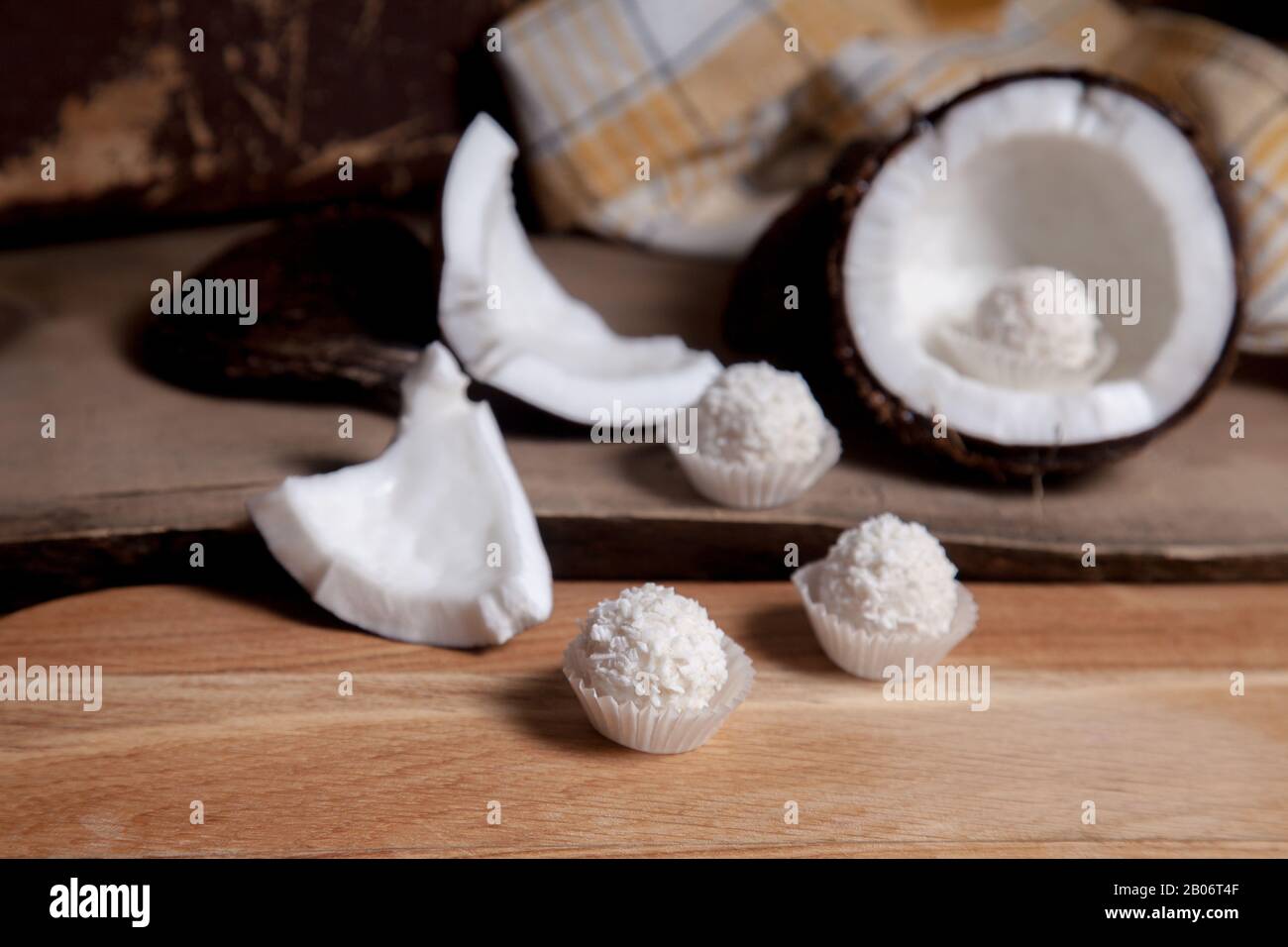 Coconut and sweet chocolate coconut truffles. Coconut shell, coconut ...