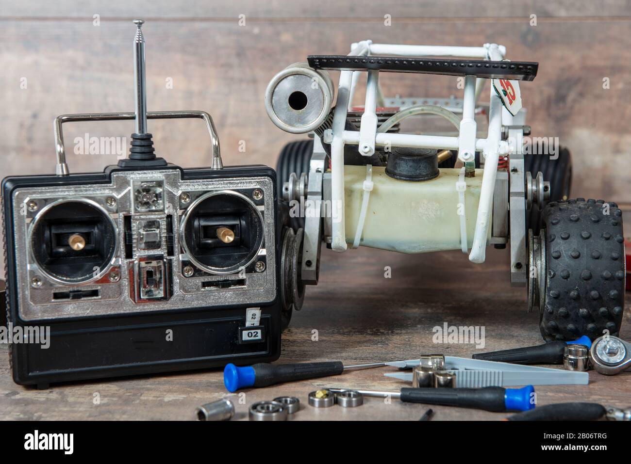 Radio-controlled car model with scattered tools for repairing rc buggy ...