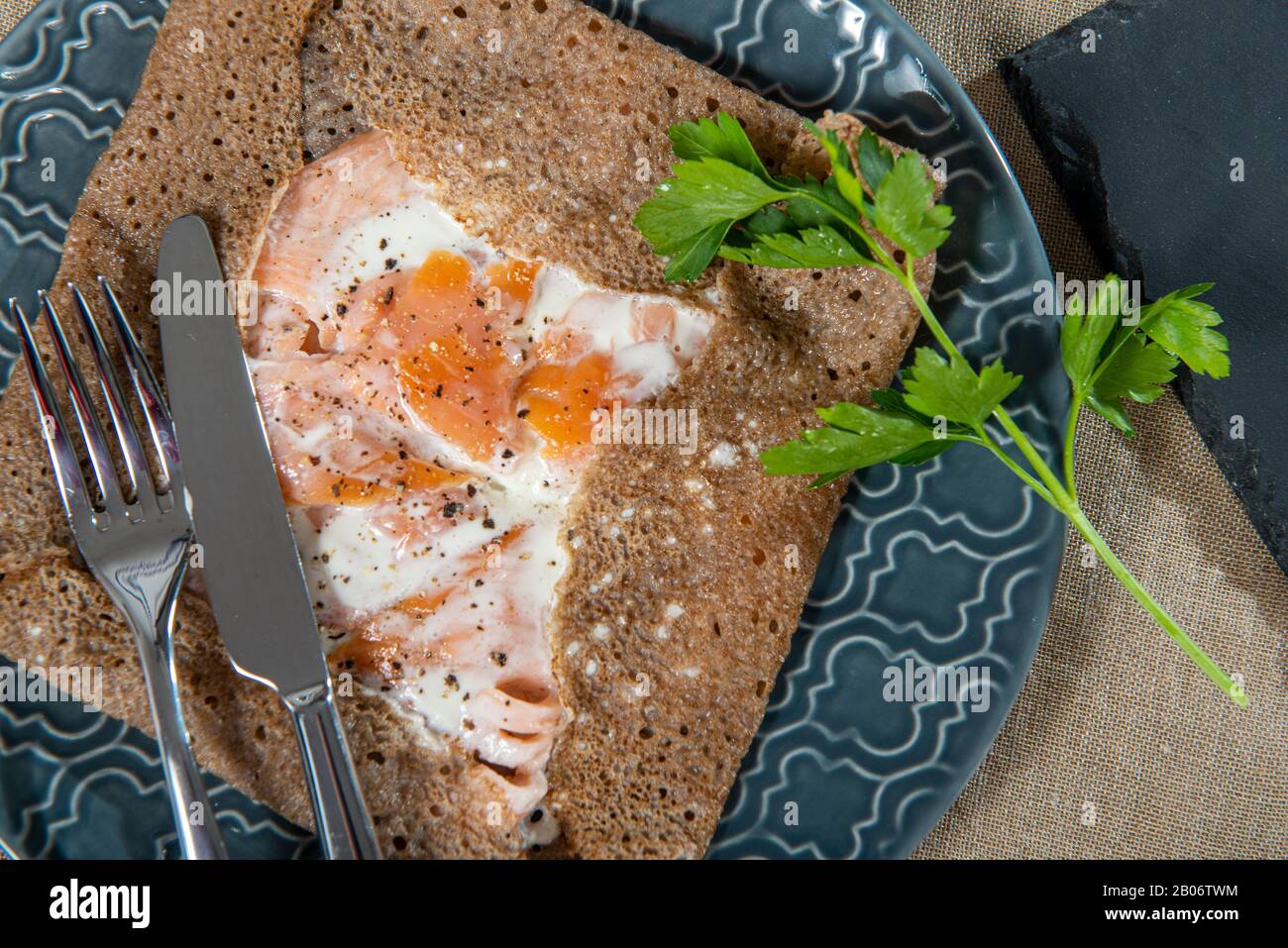 homemade Breton crepe with egg in blue plate Stock Photo - Alamy