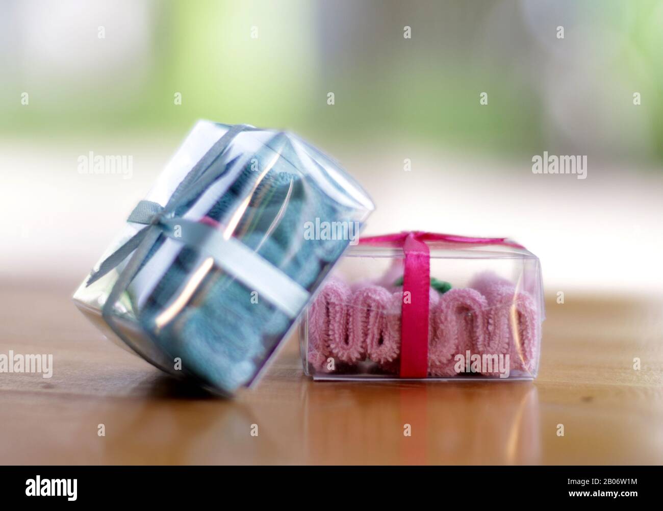 Beautiful gift box wrapped in red and blue ribbon Stock Photo - Alamy