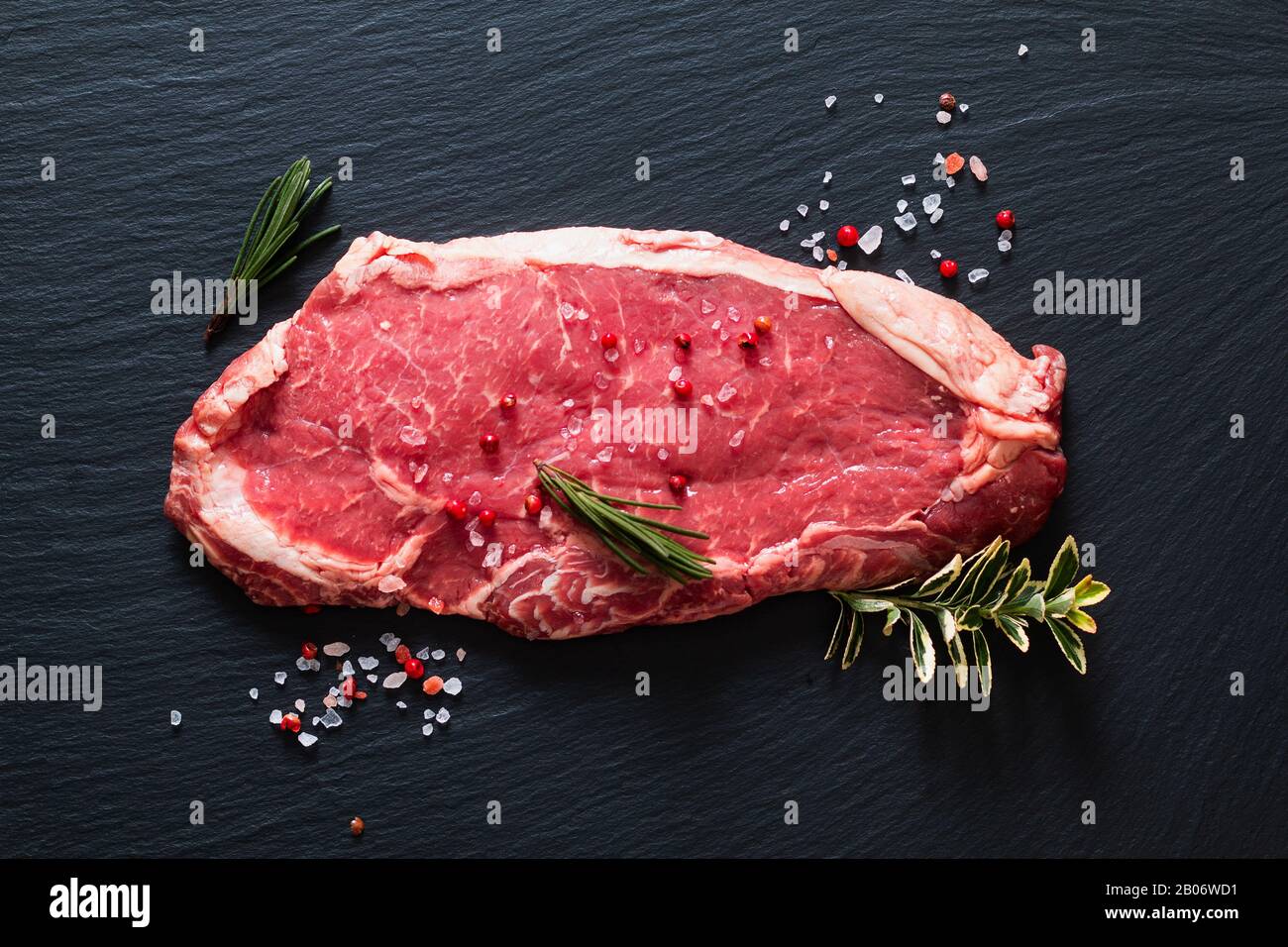 Food concept organic glass feed raw meat filet beef steak on black ...