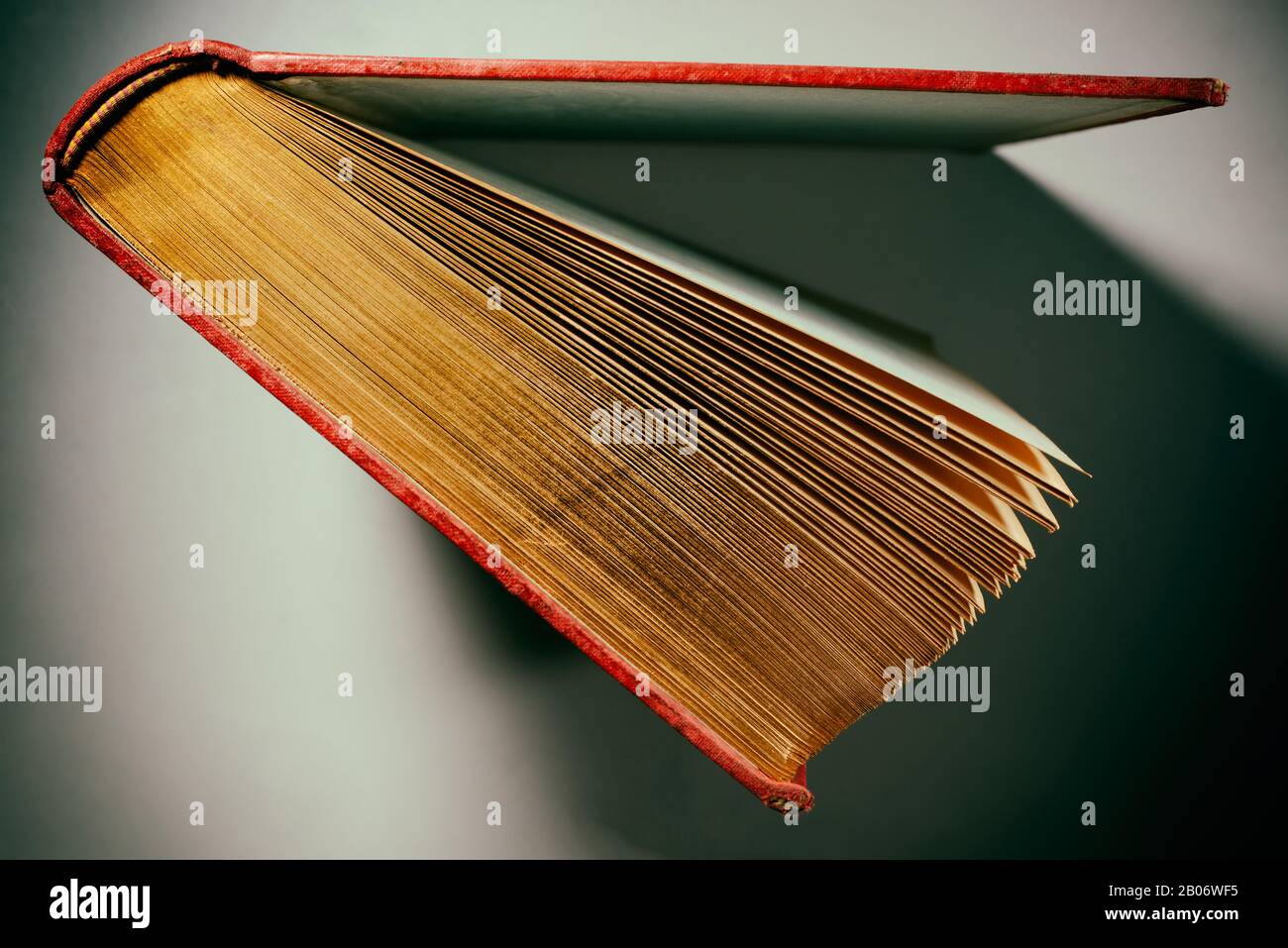 Partially opened an ancient book Stock Photo - Alamy