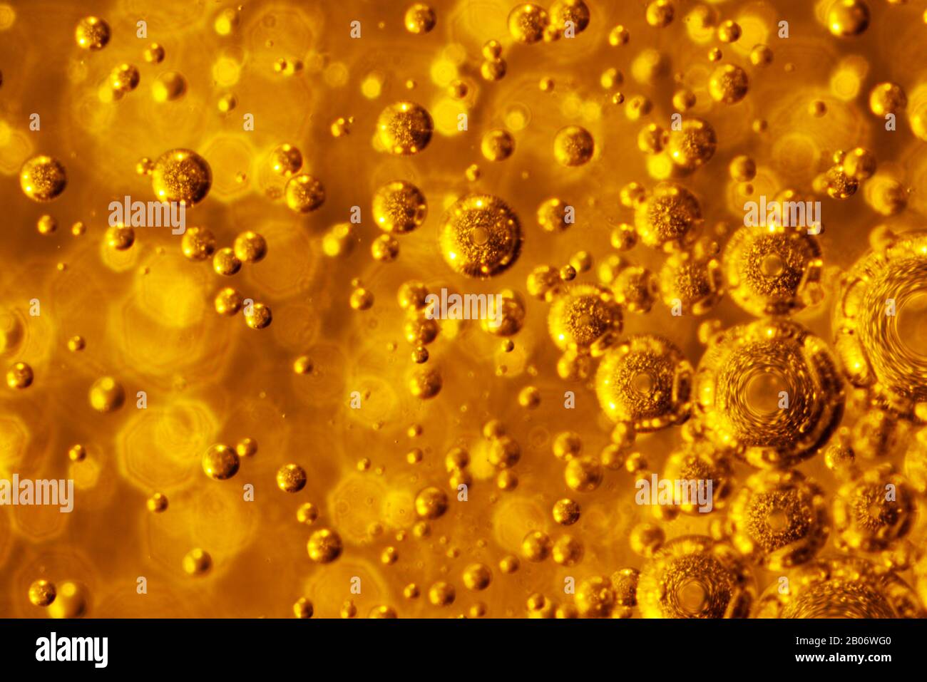 Party golden background with floating shiny golden bubbles Stock Photo ...